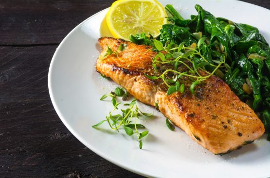 Pan Seared Wild Steelhead with Sautéed Greens | Paleoista